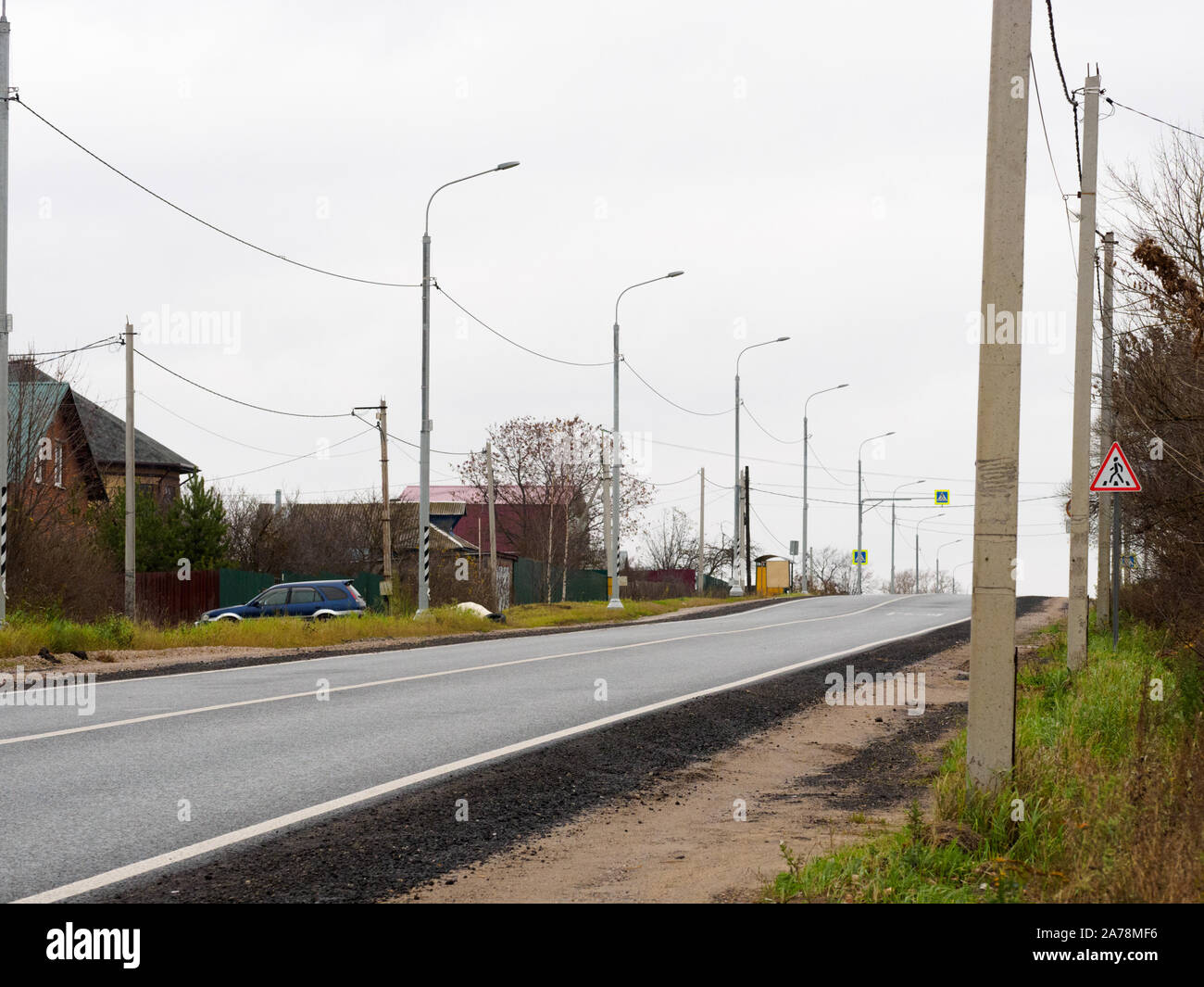 Asphalt road in the village without cars Stock Photo - Alamy