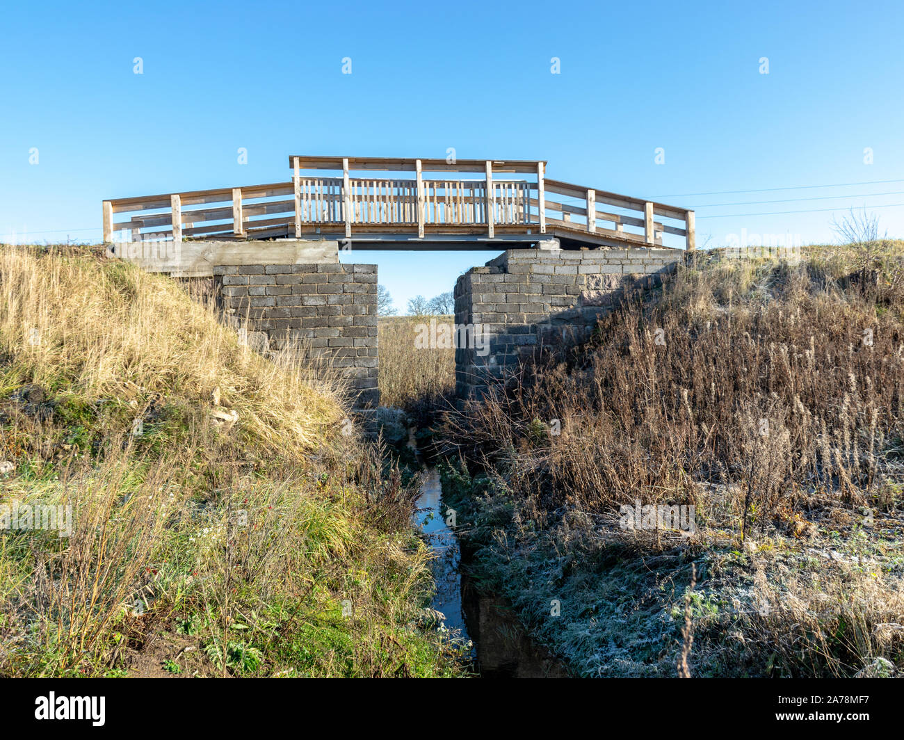 Wooden bridge over a ditch hi-res stock photography and images - Alamy