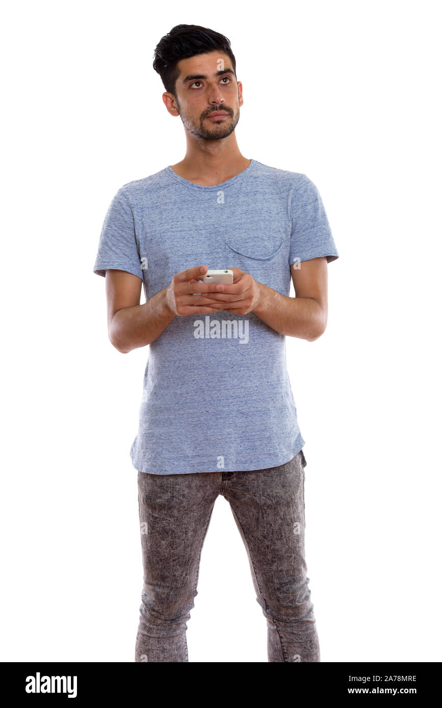Man holding phone looking up standing hi-res stock photography and ...
