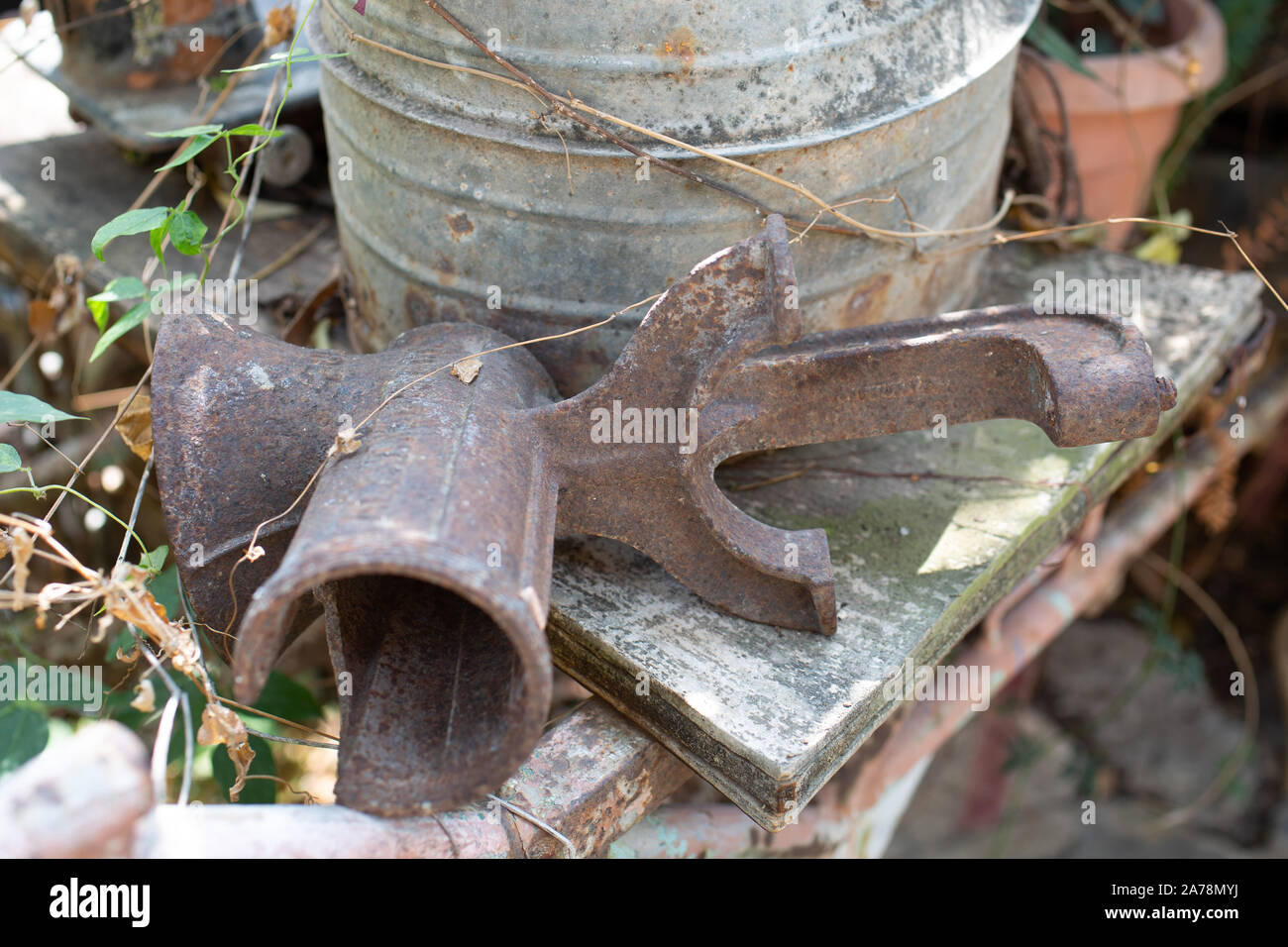 Old and rusty things and tools lying on an old wooden table Stock Photo ...