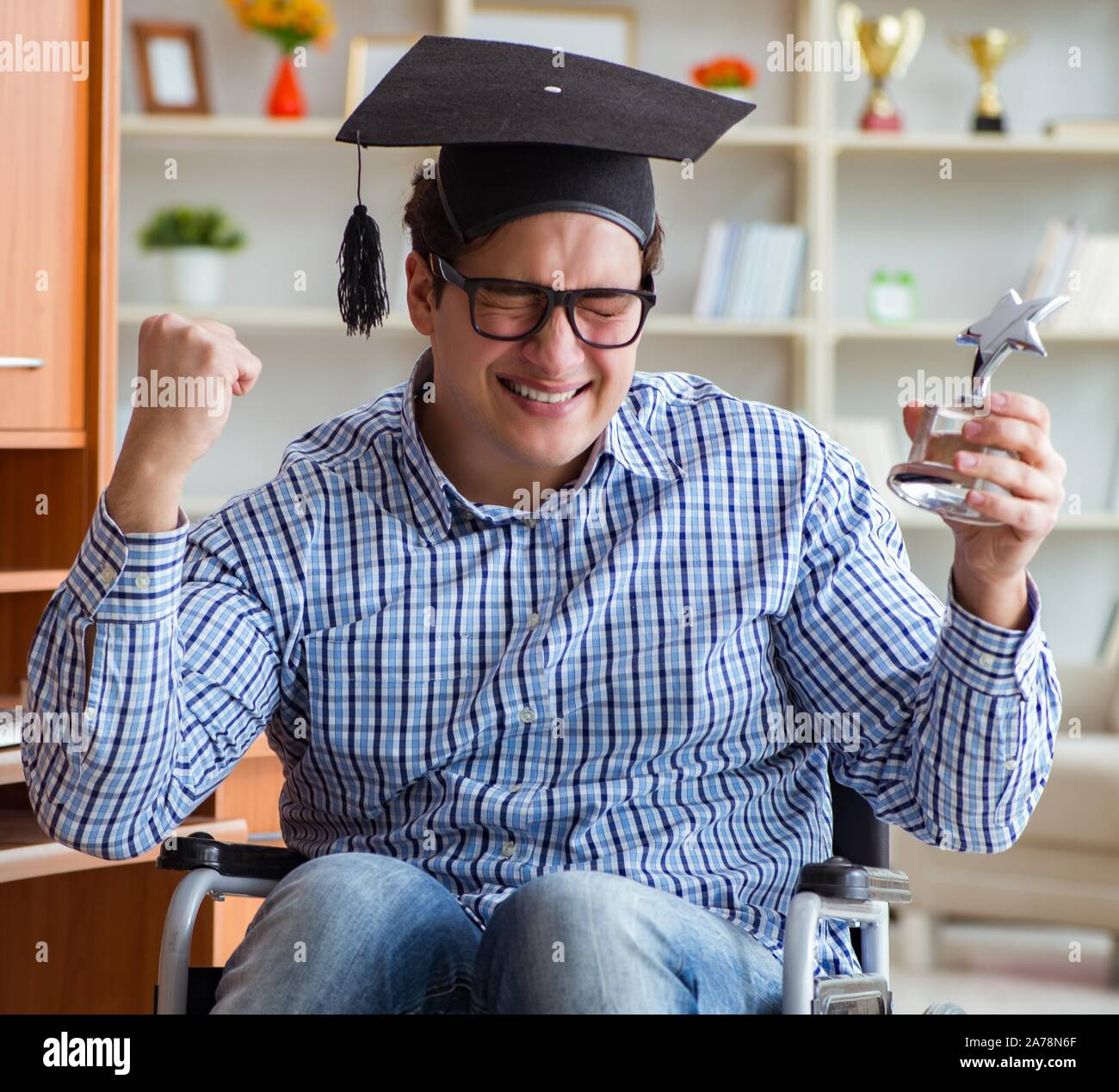 Disabled student studying at home on wheelchair Stock Photo - Alamy