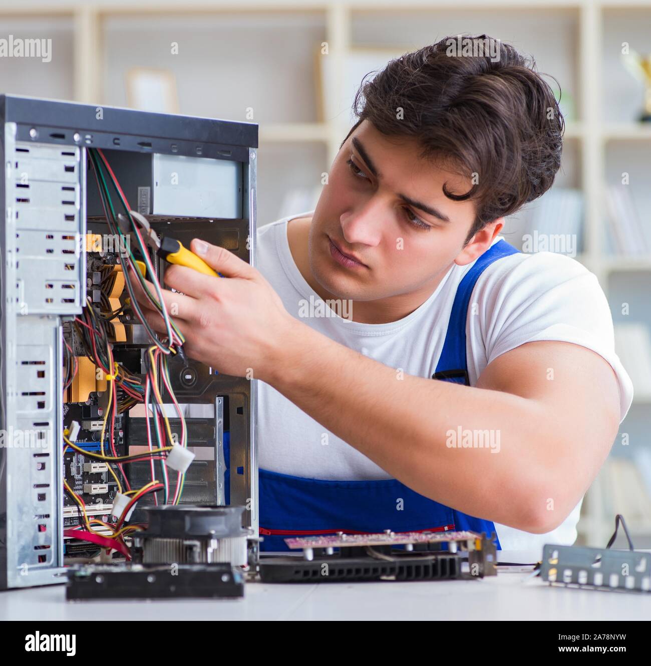 The computer repairman repairing desktop computer Stock Photo - Alamy