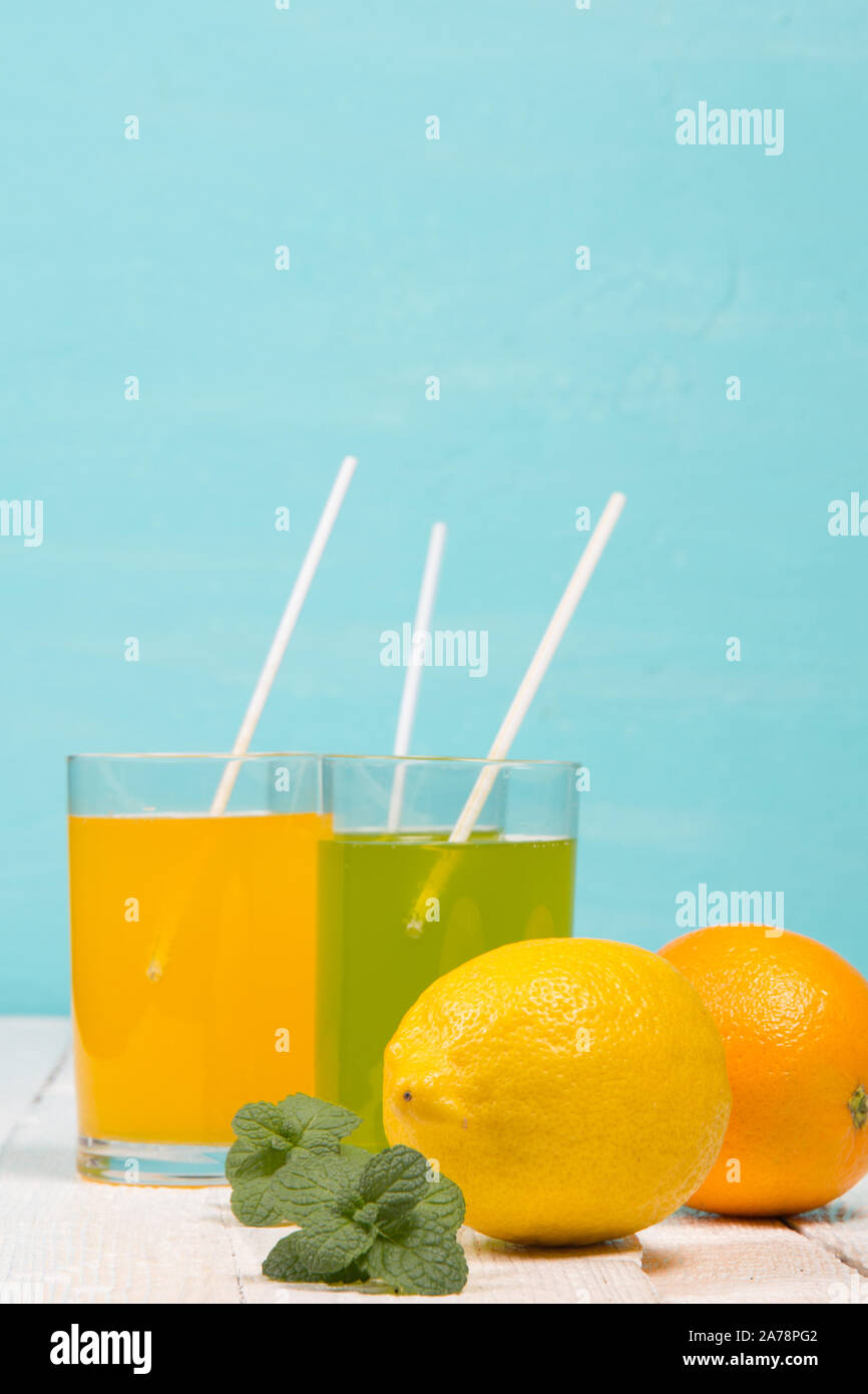 Refreshing drinks from fresh fruit on a turquoise background Stock ...