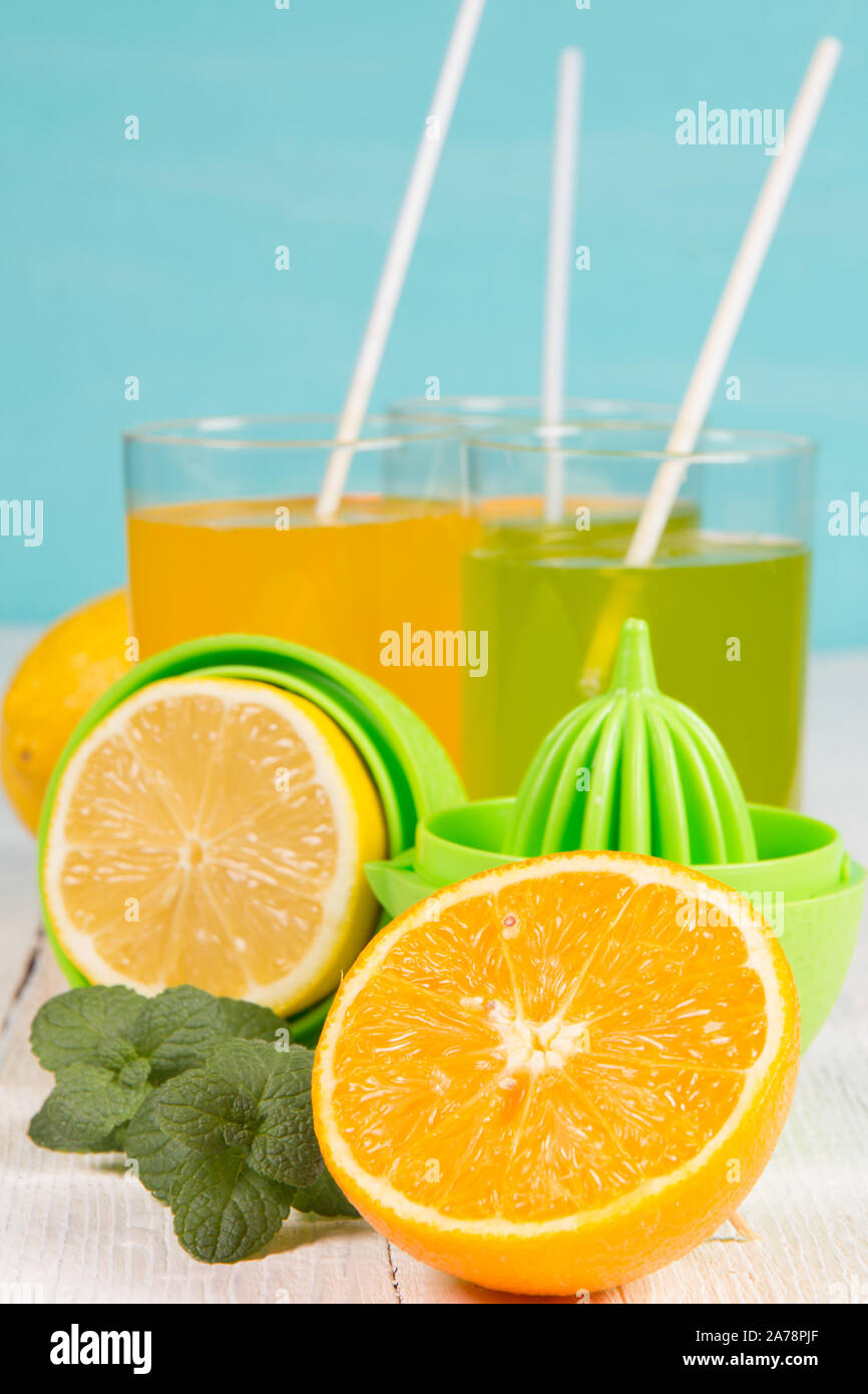Refreshing drinks from fresh fruit on a turquoise background Stock ...