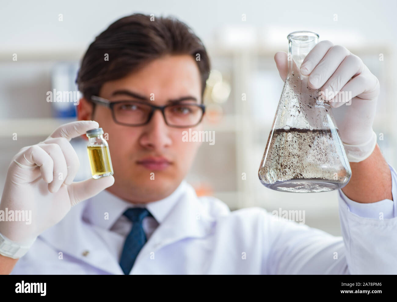 Young researcher scientist doing a water test contamination experiment ...