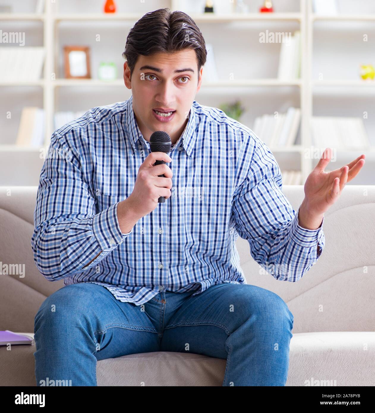 Funny man singing songs in karaoke at home Stock Photo - Alamy