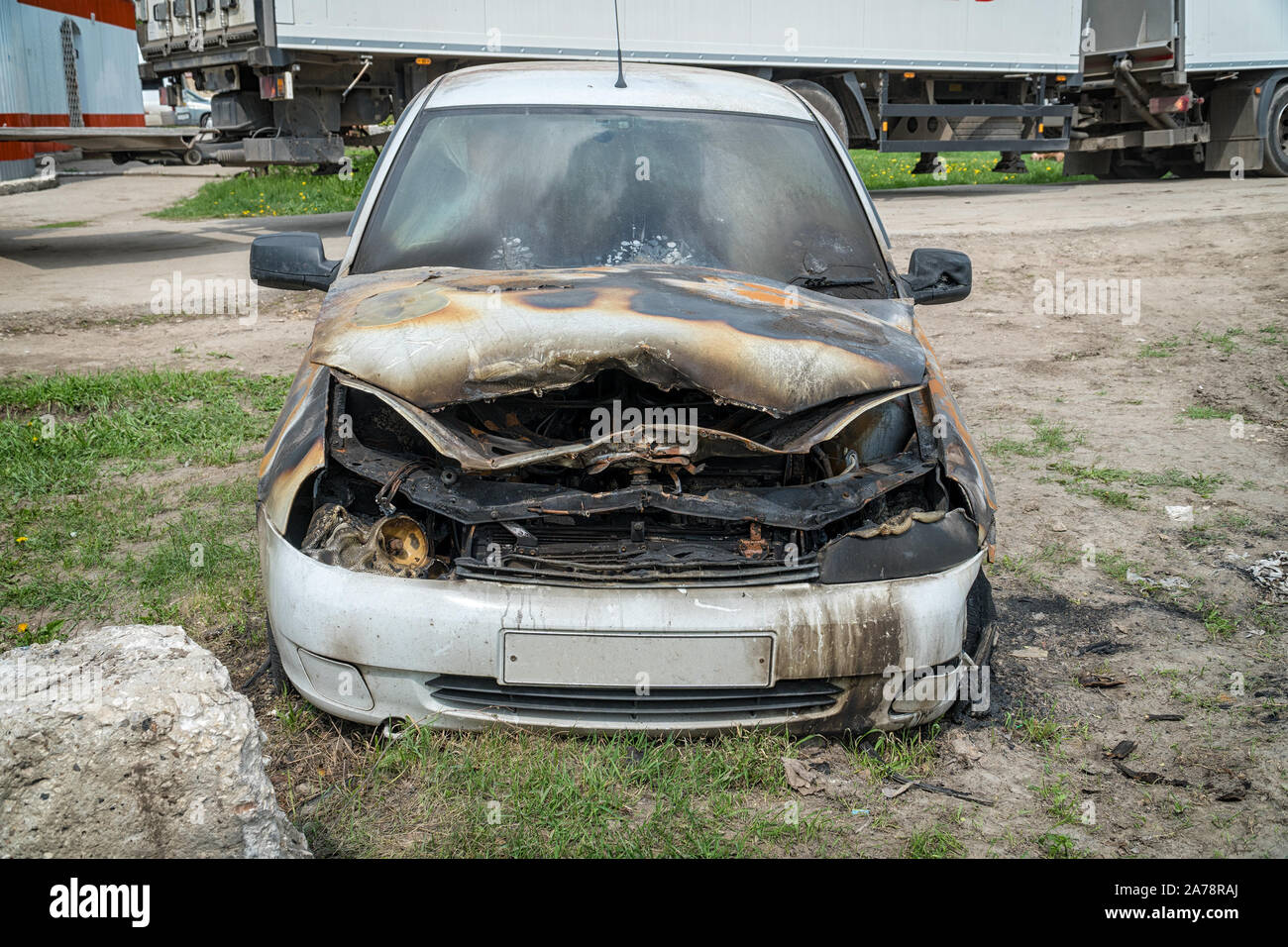 Burnt car on the street. Front view Stock Photo - Alamy