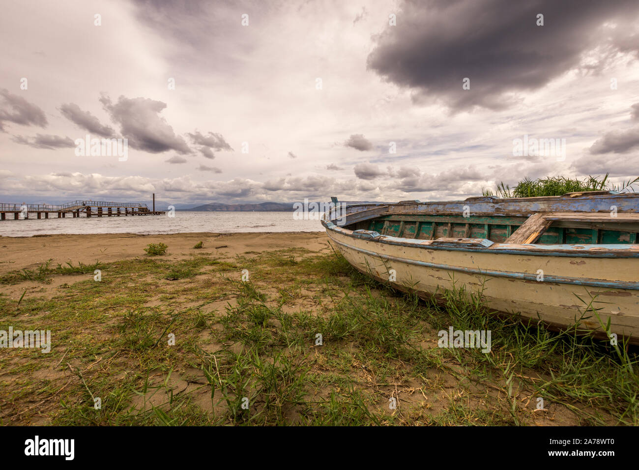 Abandoned boat on an isolated beach Stock Photo - Alamy