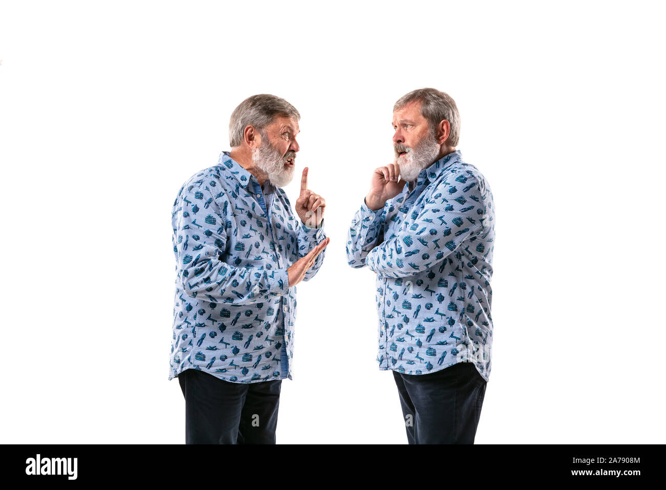 Senior man arguing with himself on white studio background. Concept of ...