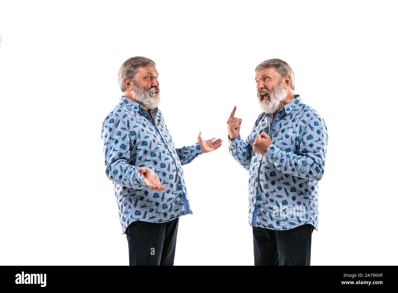 Senior man arguing with himself on white studio background. Concept of ...