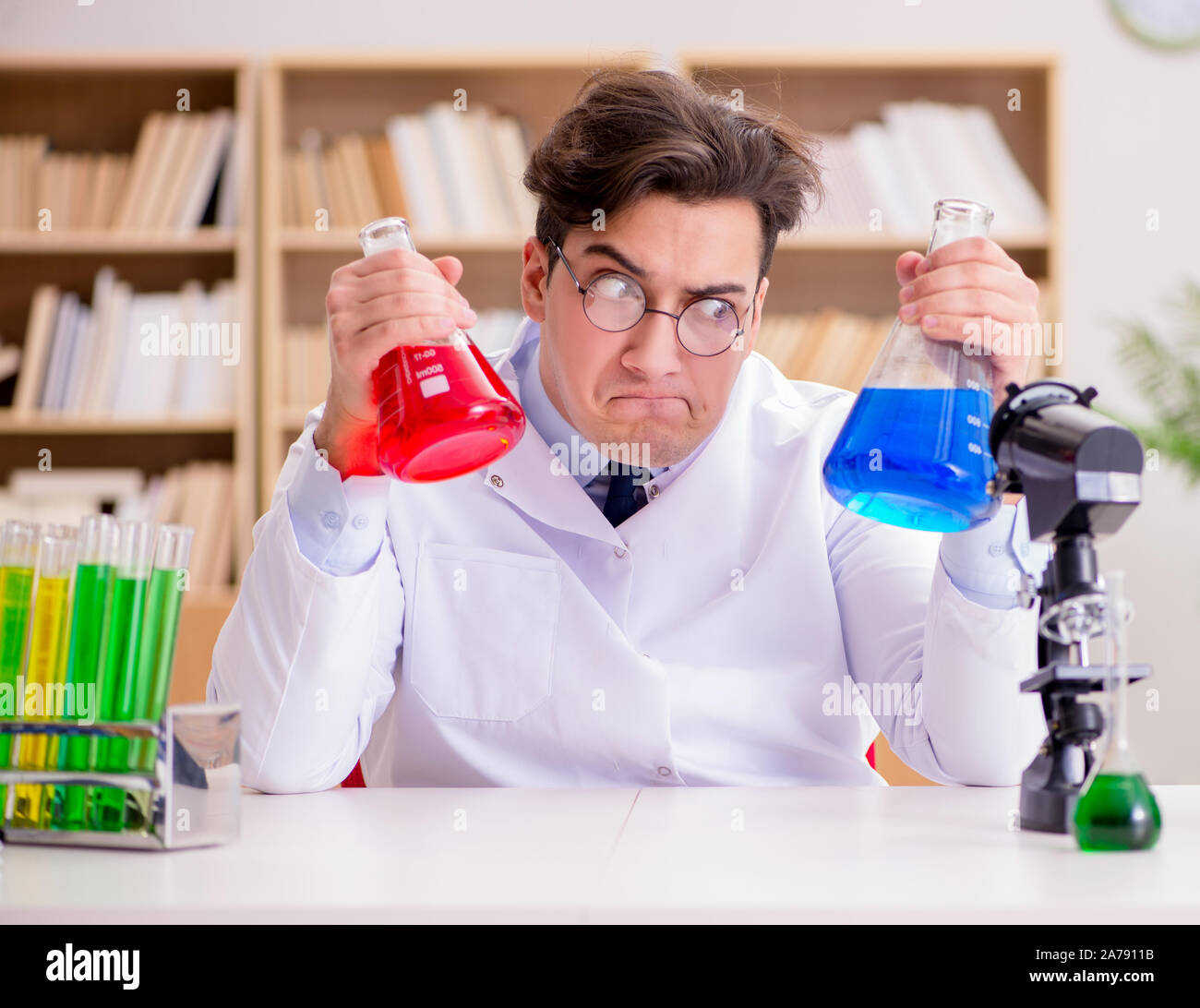 The mad crazy scientist doctor doing experiments in a laboratory Stock ...
