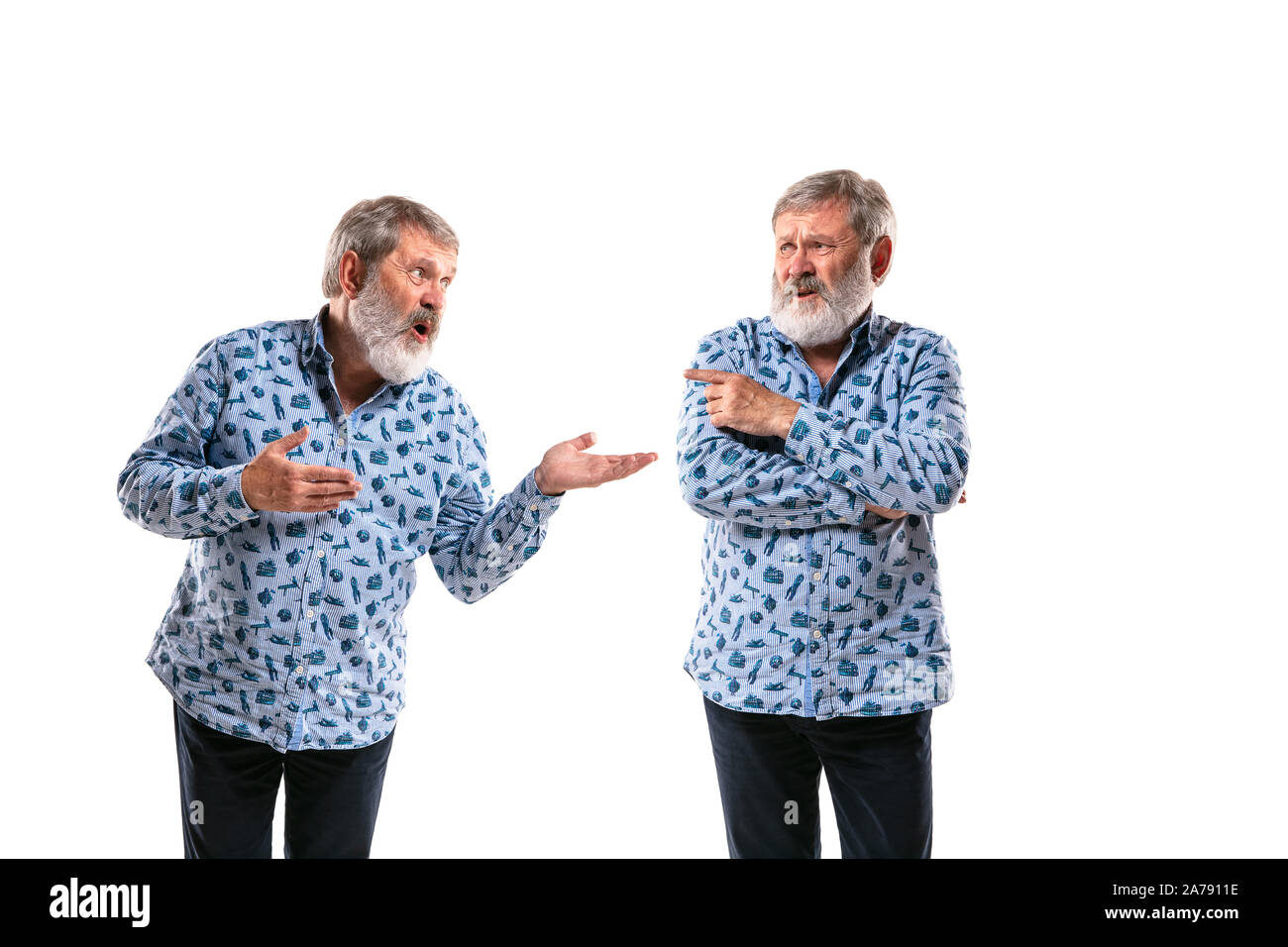 Senior man arguing with himself on white studio background. Concept of ...