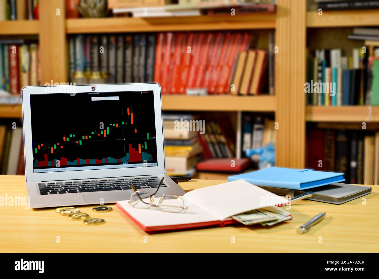 on the table golden bitcoins, notebook, eyeglases and laptop with stock ...