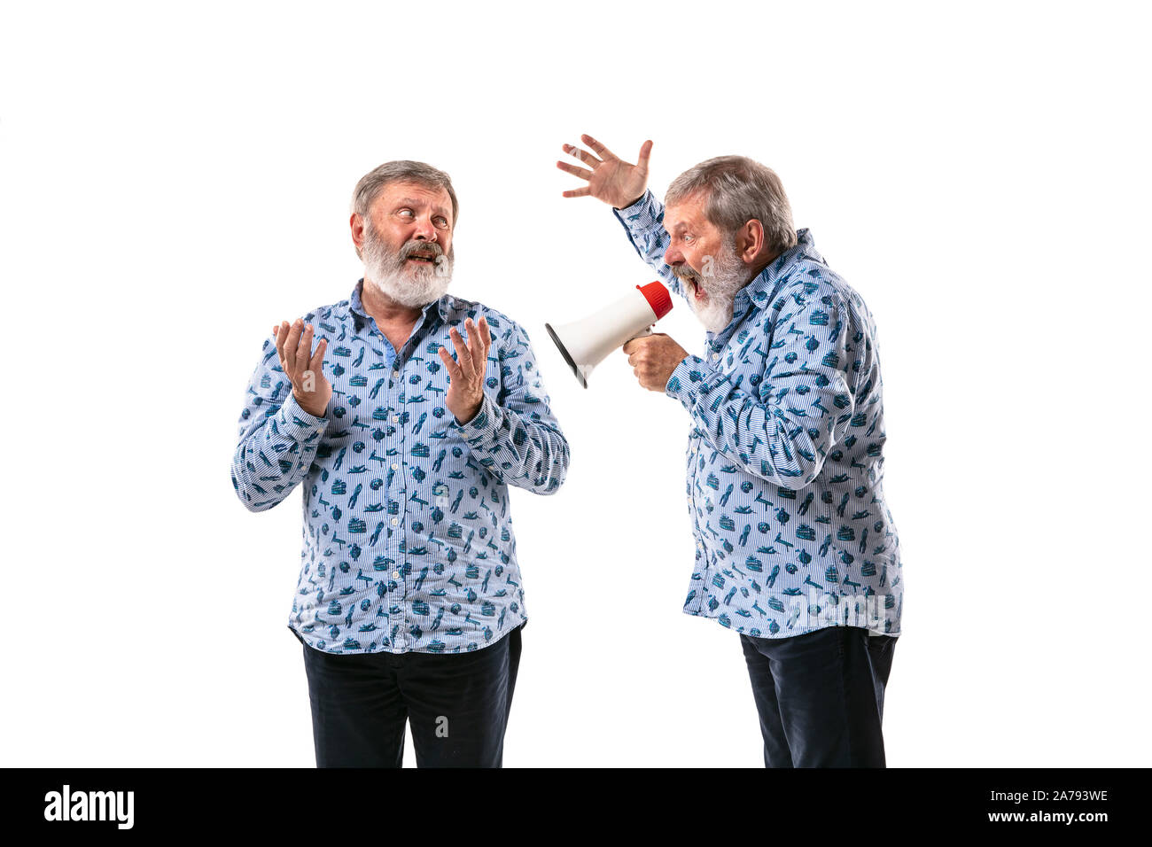 Senior man arguing with himself on white studio background. Concept of ...