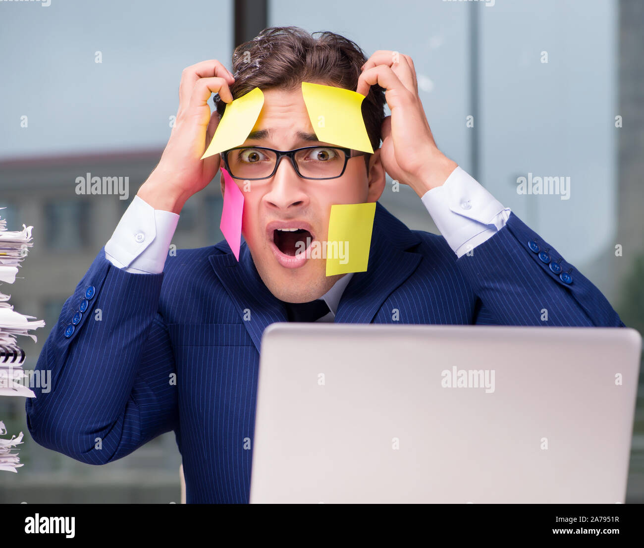 The workaholic businessman overworked with too much work in office ...