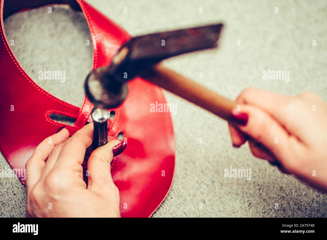 Professional shoemaker using hammer making hi-res stock photography and ...