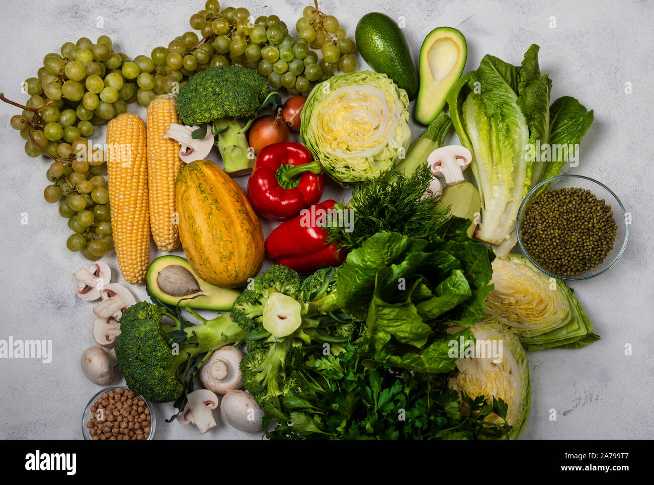Collection of different fresh raw vegetables on a light background. Top ...