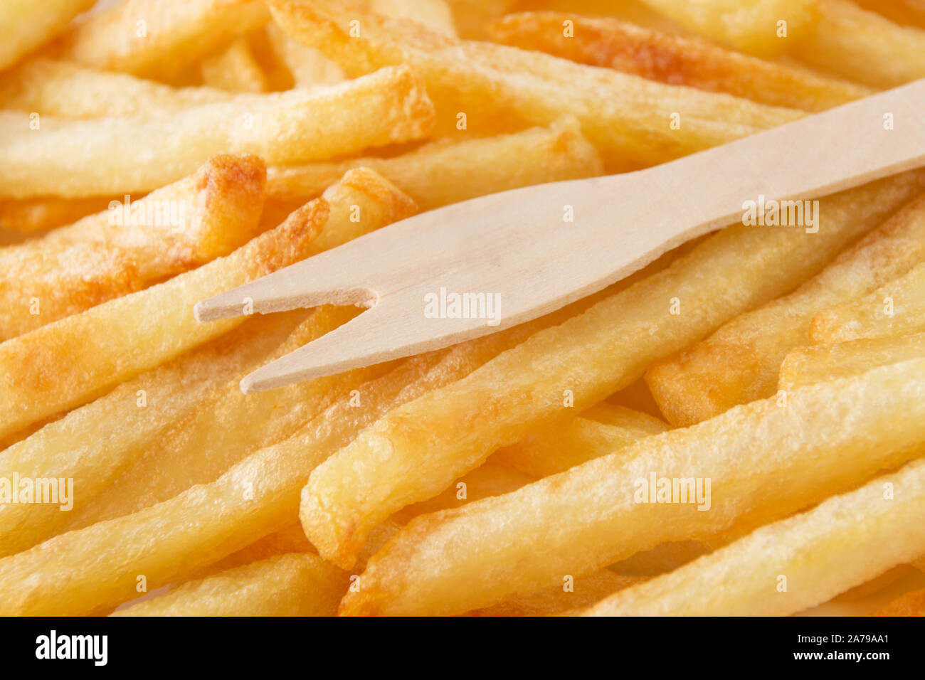 Potato chips with fork close up Stock Photo - Alamy