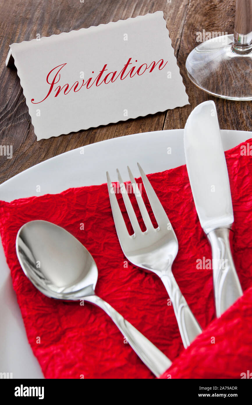 Eating table - dishes and flatware with label Stock Photo - Alamy