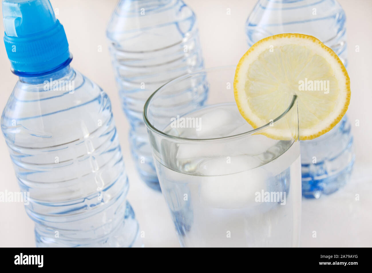 Mineral water with lemon and ice Stock Photo - Alamy
