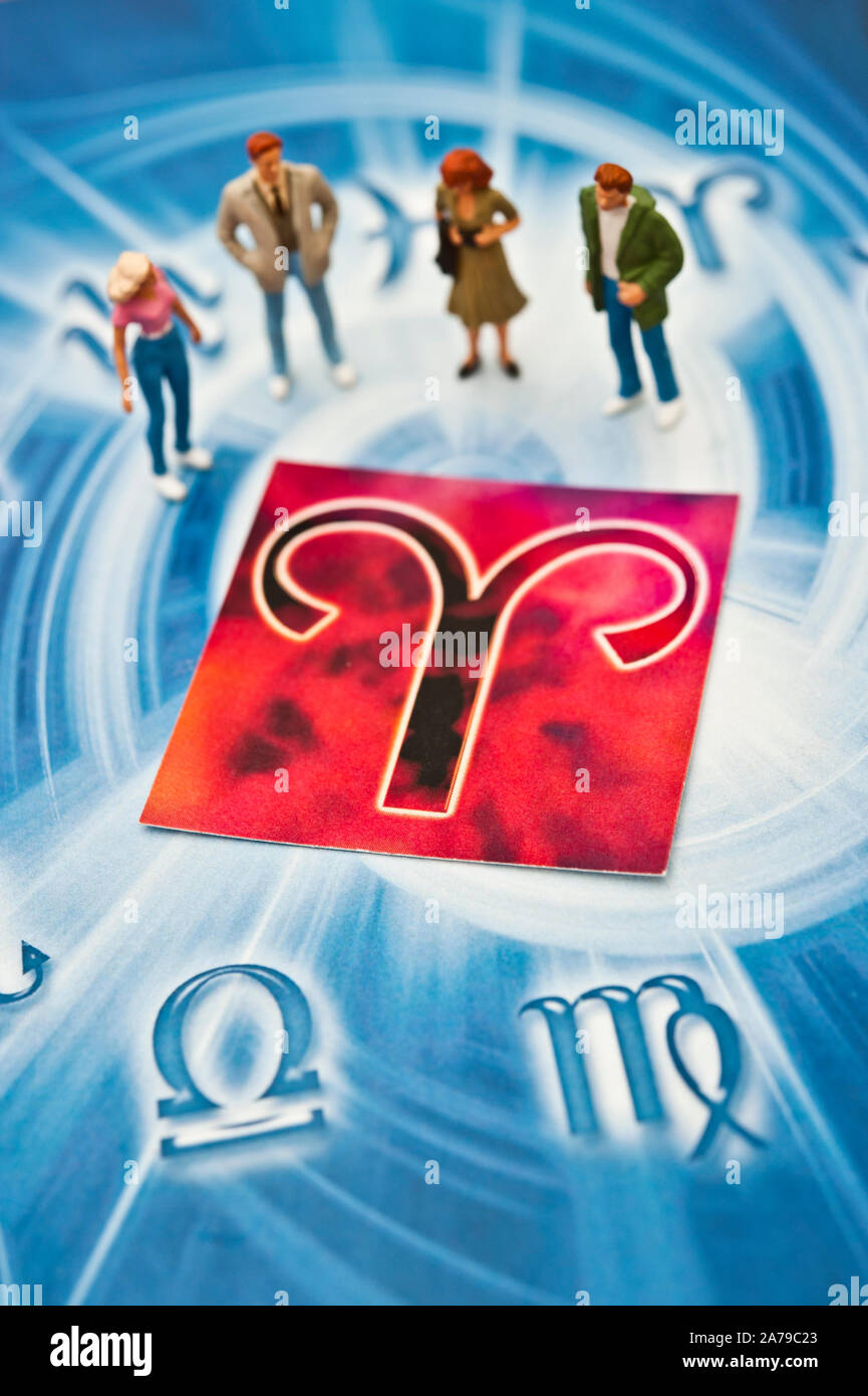 people miniature figurines and zodiac sign of Aries Stock Photo - Alamy