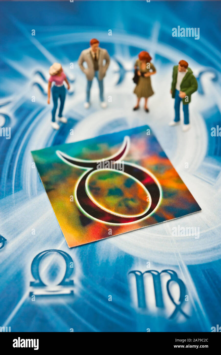 people miniature figurines and zodiac sign of Taurus Stock Photo - Alamy