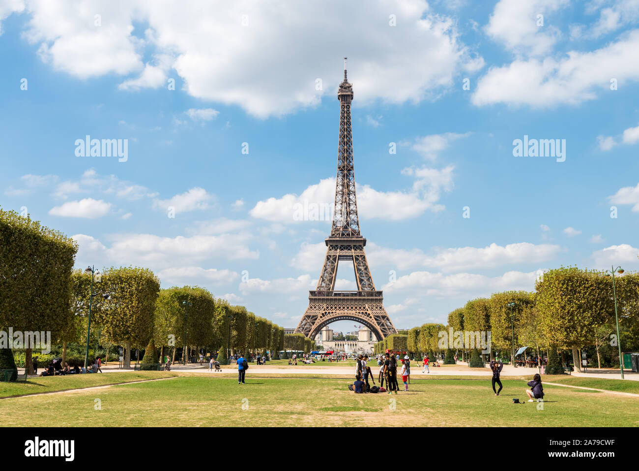 The Eiffel Tower against blue and cloudy sky, a wrought-iron lattice ...