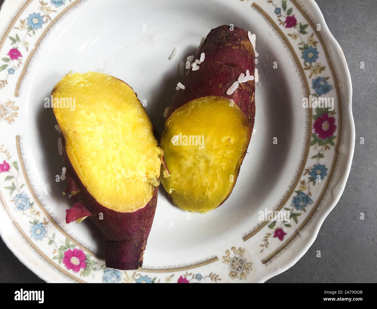 Sweet potatoes on white dish. Its large, starchy, sweet-tasting ...