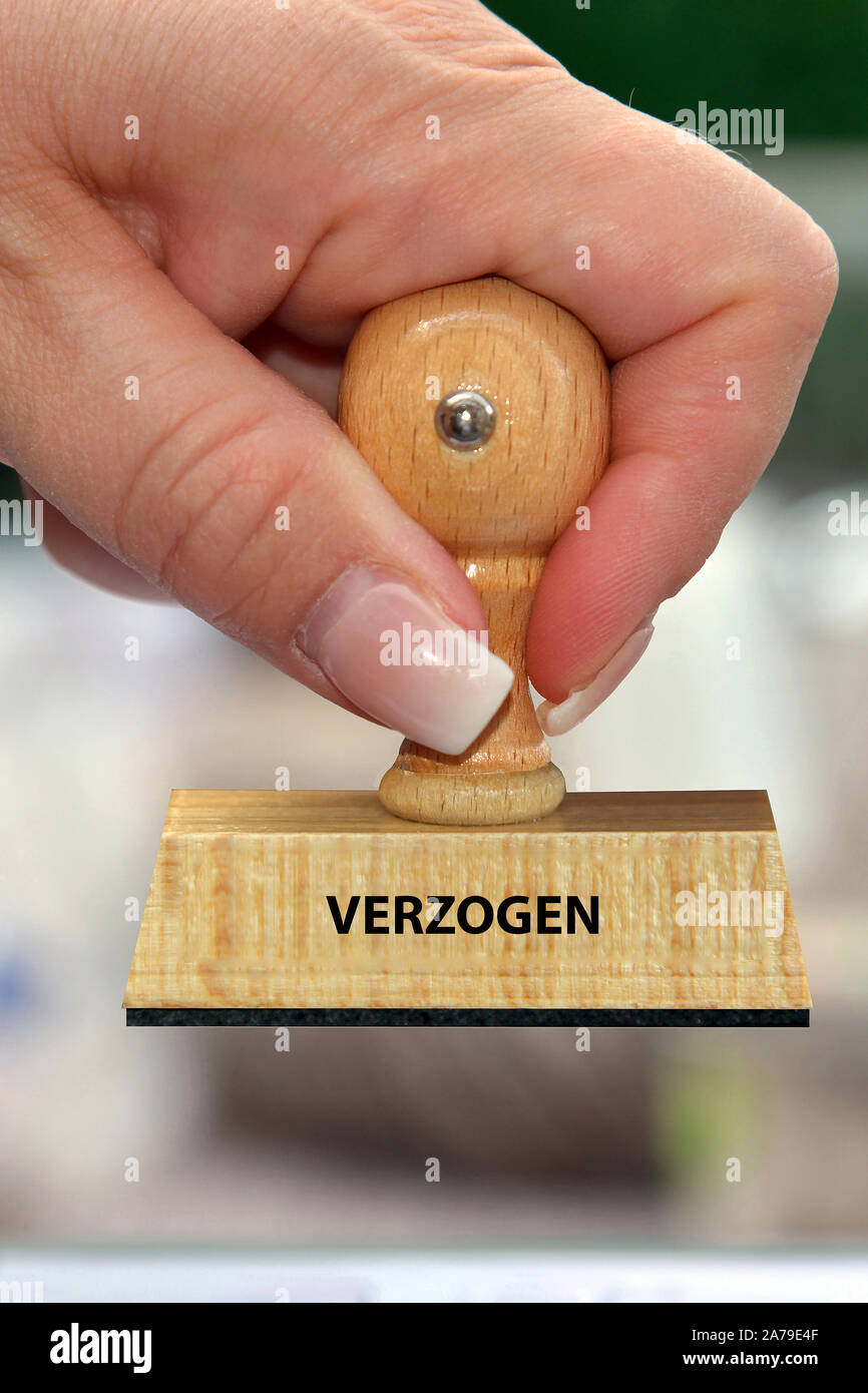 Hand mit Stempel, Frauenhand, Aufschrift: Verzogen Stock Photo - Alamy