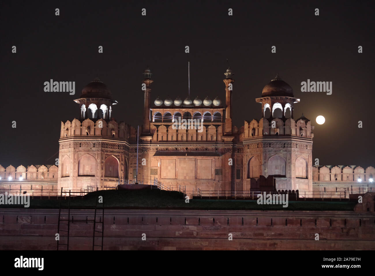 The red fort in Delhi, India by night with the full moon in the back ...