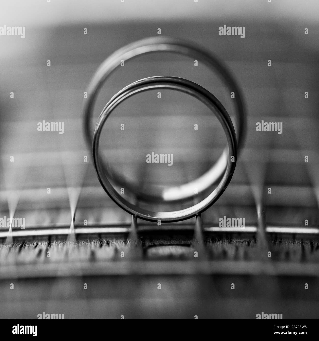 Two Wedding Rings on guitar strings. Shallow Depth Of Field Stock Photo ...