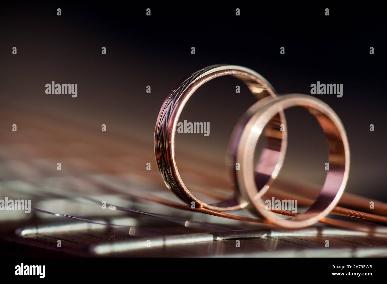 Two Wedding Rings on guitar strings. Shallow Depth Of Field Stock Photo ...