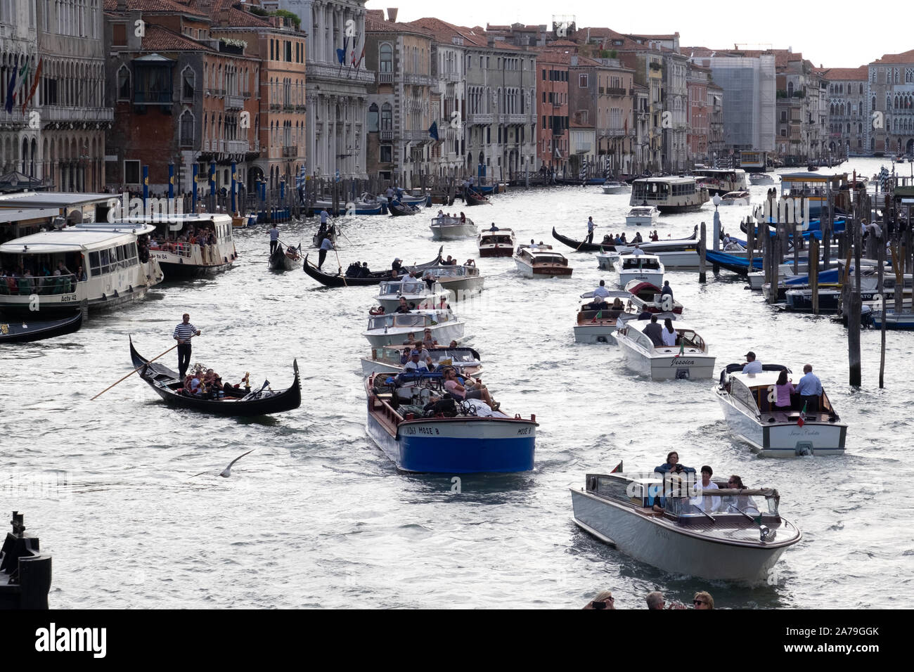 Muted colours of a busy scene on the Grand Canal, Venice. Crammed with ...
