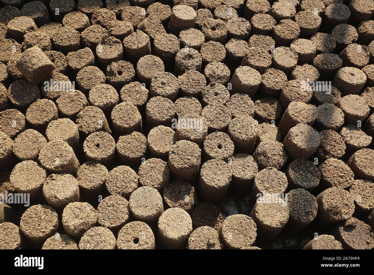 Palestinians make molds from olive pomace that is obtained from the ...