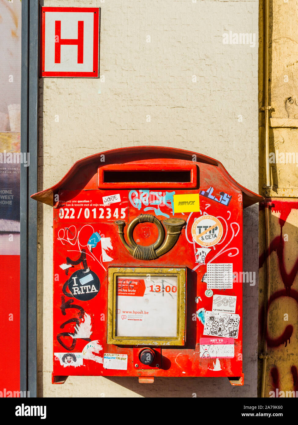 Belgian post box covered with stickers - Brussels Stock Photo - Alamy