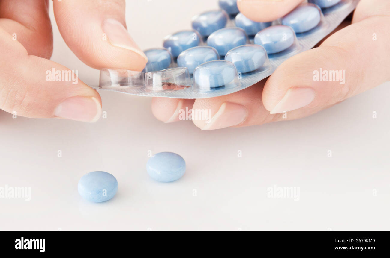 Male hand in blue medical hi-res stock photography and images - Alamy