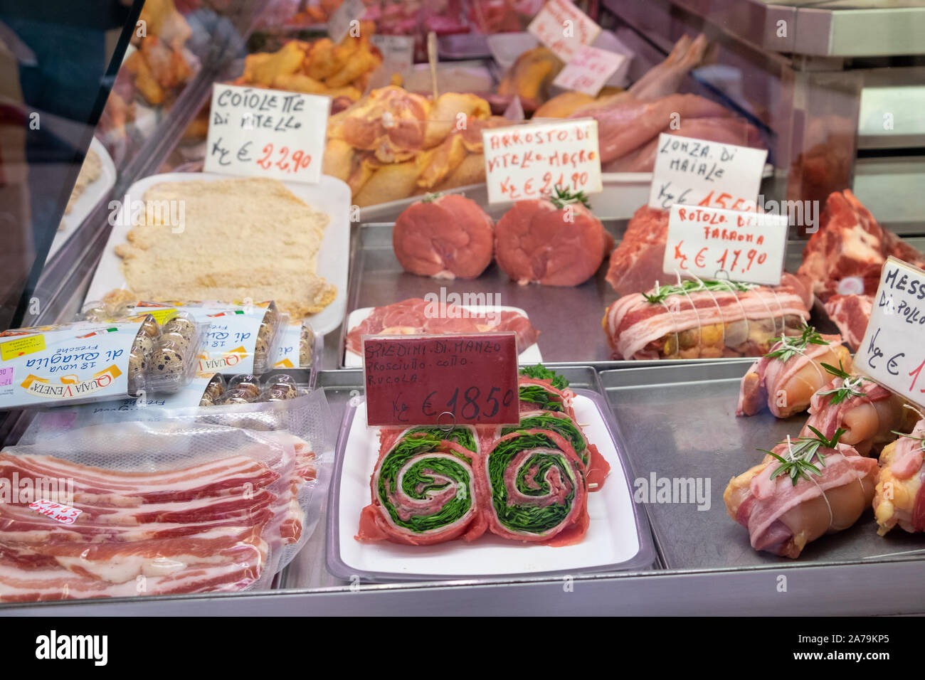 Shop display of processed and raw meats in an attractive selection for ...