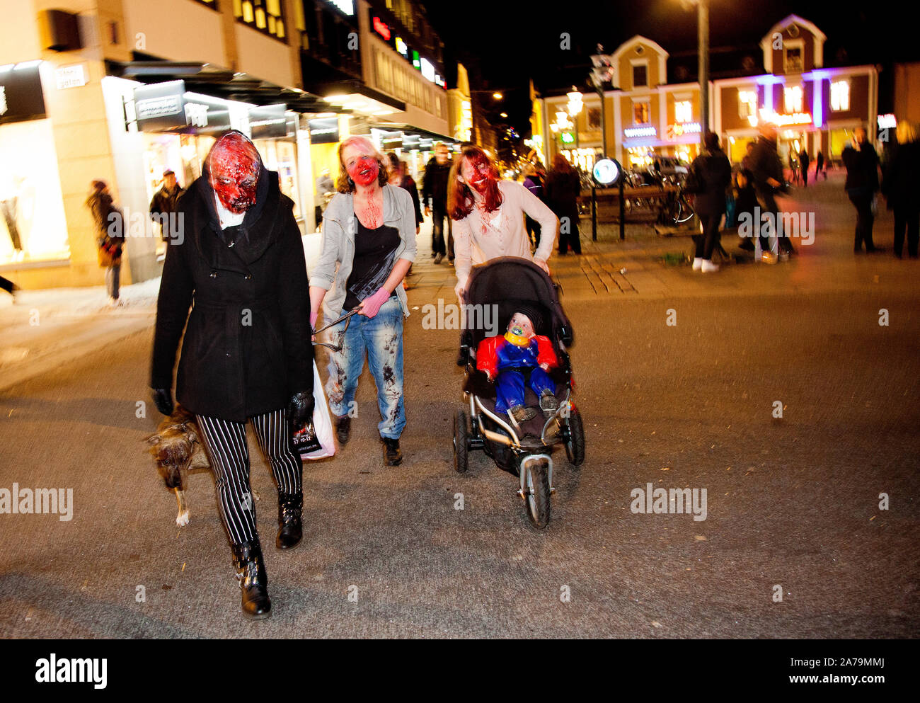 Zombie walk during Halloween in central Linköping, Sweden. Young people ...