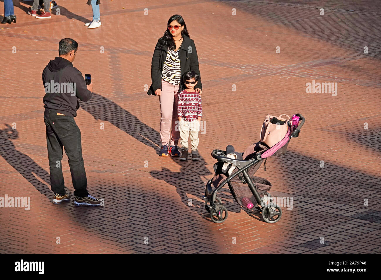 An Asian family taking photographs of themselves in Pioneer Courthouse ...