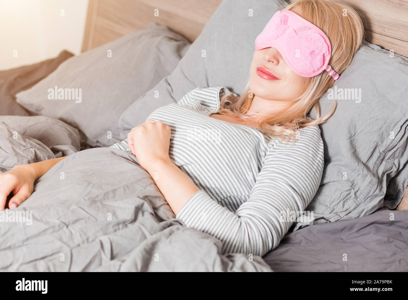 Young blonde woman sleeping in bed. Closeup overhead portrait of ... Young blonde woman sleeping in bed. Closeup overhead portrait of ...
