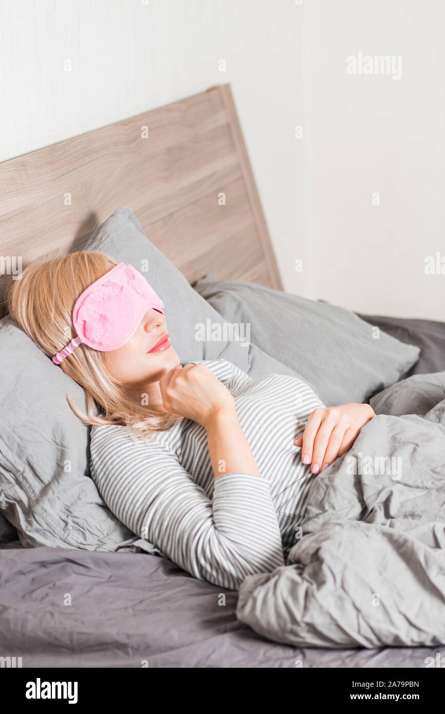 Young blonde woman sleeping in bed. Closeup overhead portrait of ... Young blonde woman sleeping in bed. Closeup overhead portrait of ...
