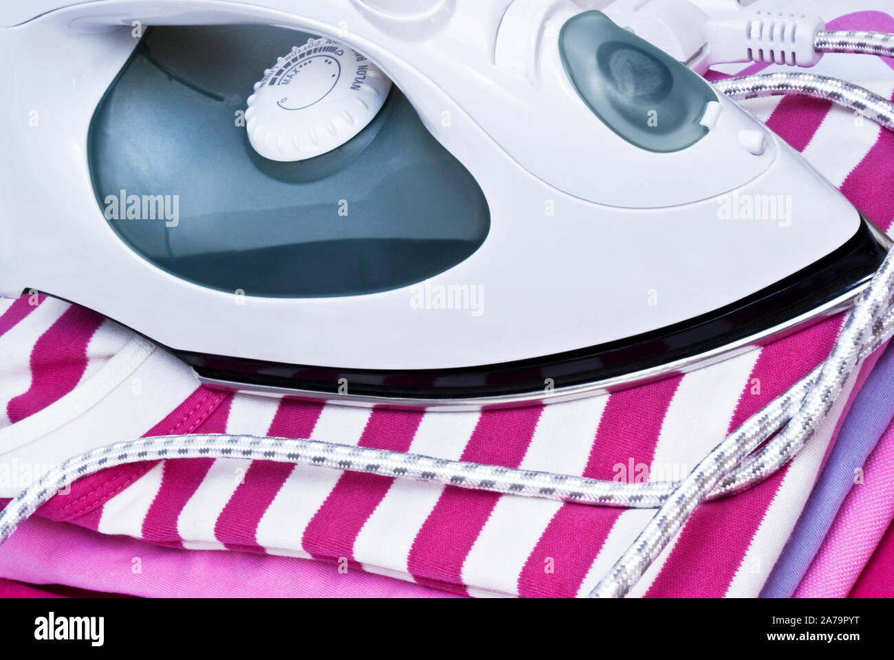 Iron and clothes Stock Photo - Alamy