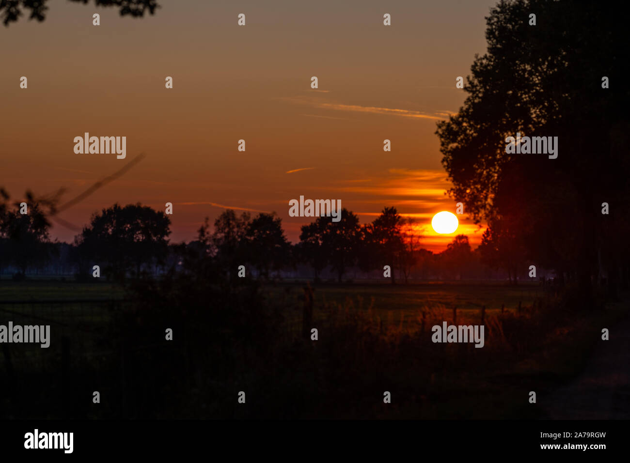 A special sunset with intense colors in the autumn evening Stock Photo ...