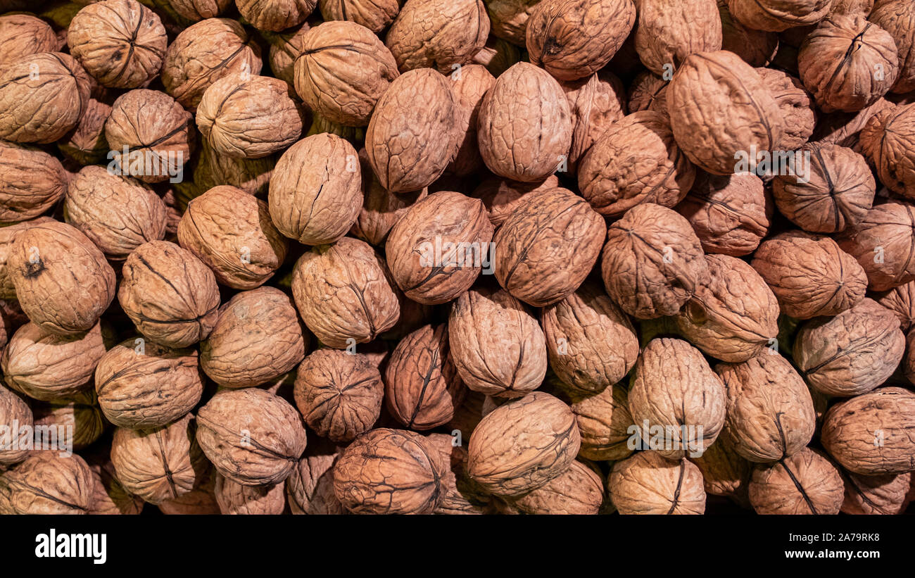 Whole walnuts texture and color background; natural pattern of a stack ...