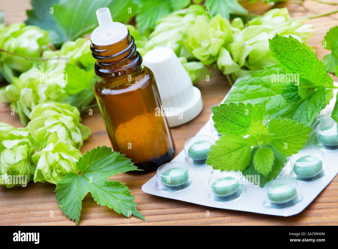 Homeopathy, Globules and herbs Stock Photo - Alamy
