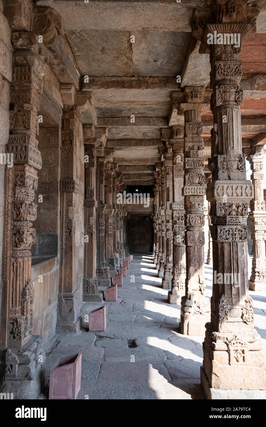 Intricate stone carvings on the cloister columns at Quwwat ul-Islam ...