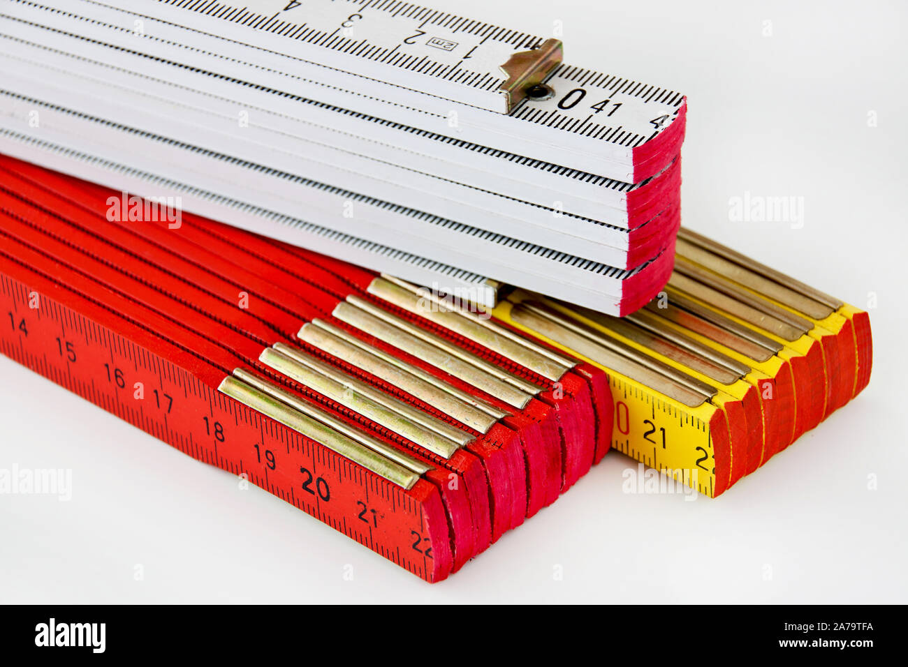 Different Yardsticks on white background Stock Photo - Alamy