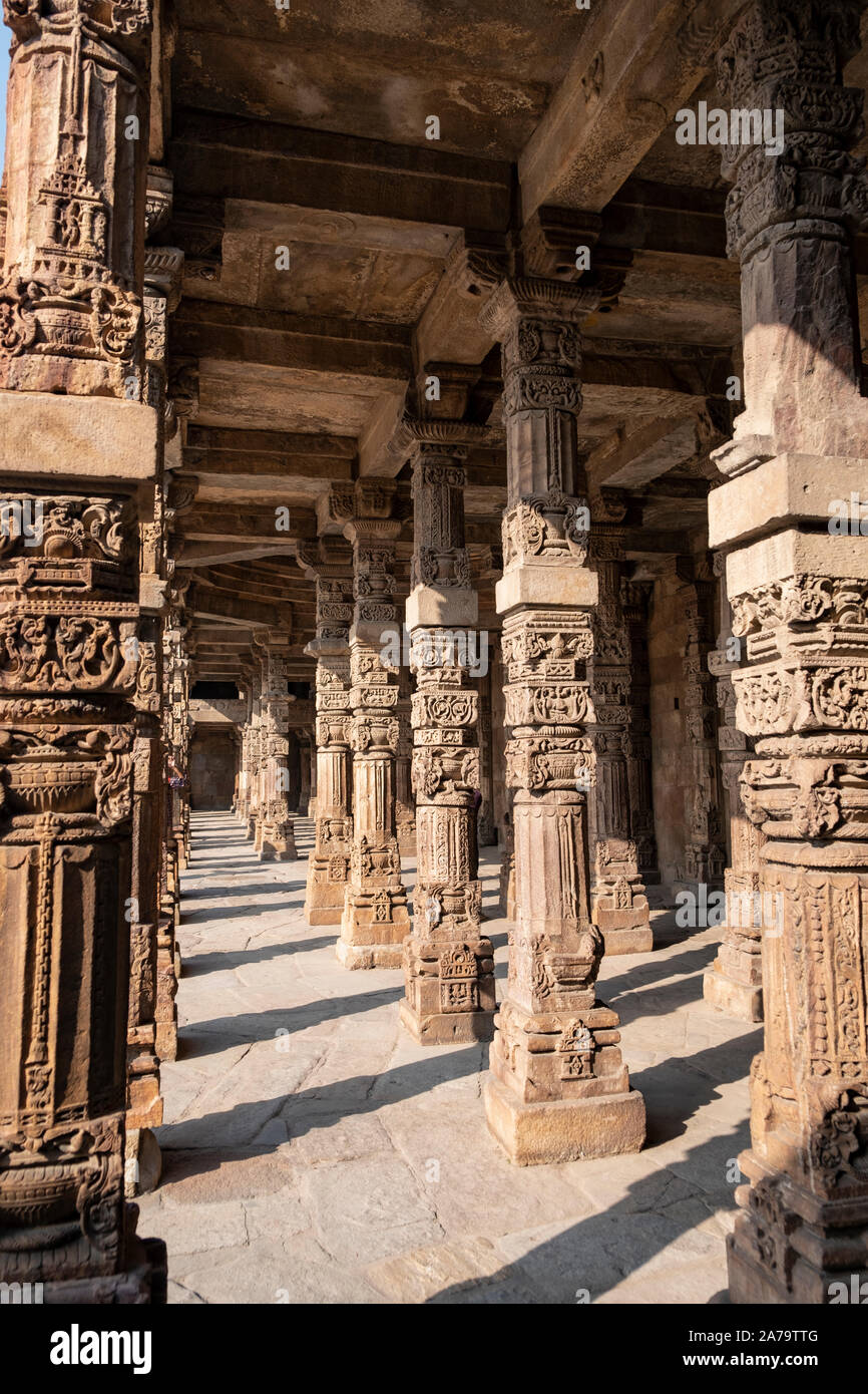 Intricate stone carvings on the cloister columns at Quwwat ul-Islam ...