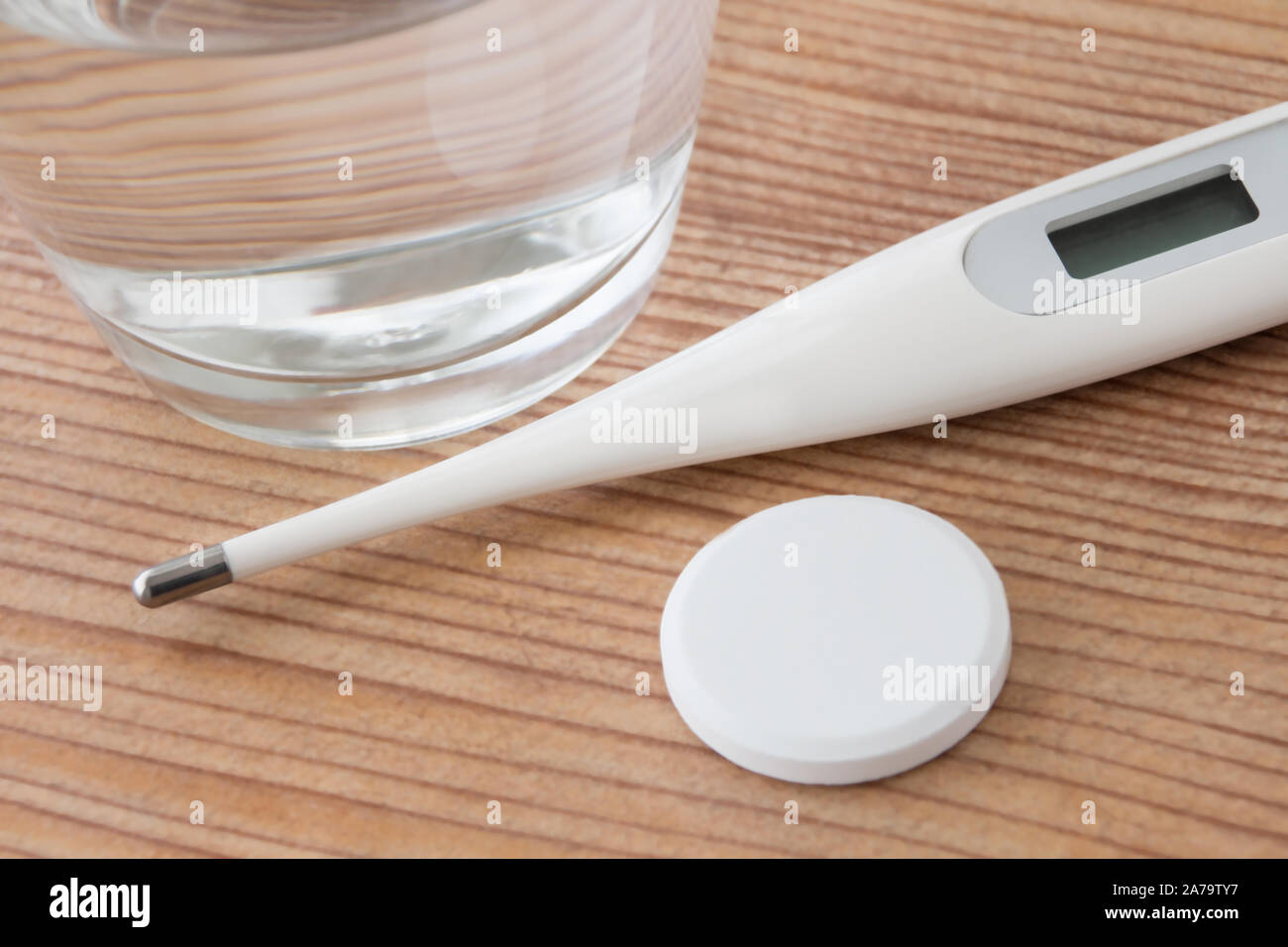 Medicine with tablets and fever thermometer Stock Photo - Alamy