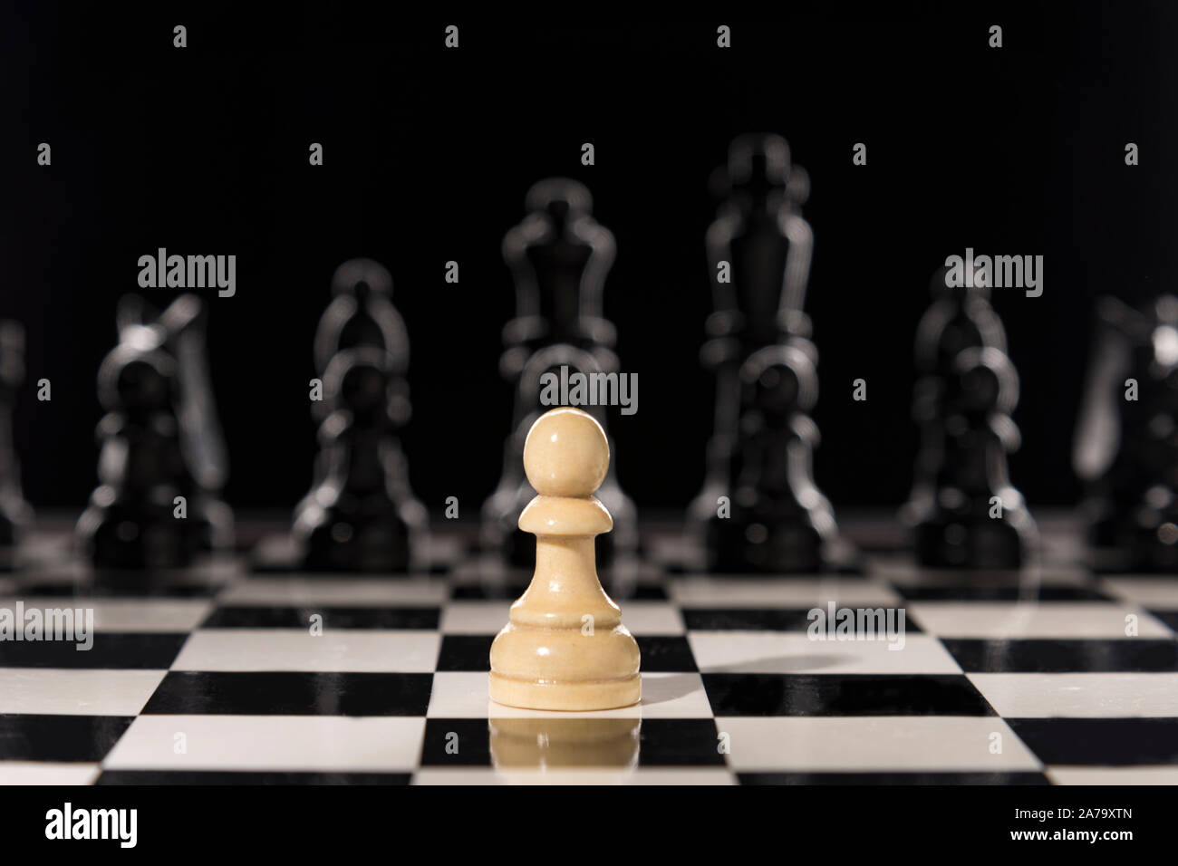 Single pawn against many enemies as a symbol of difficult unequal fight ...